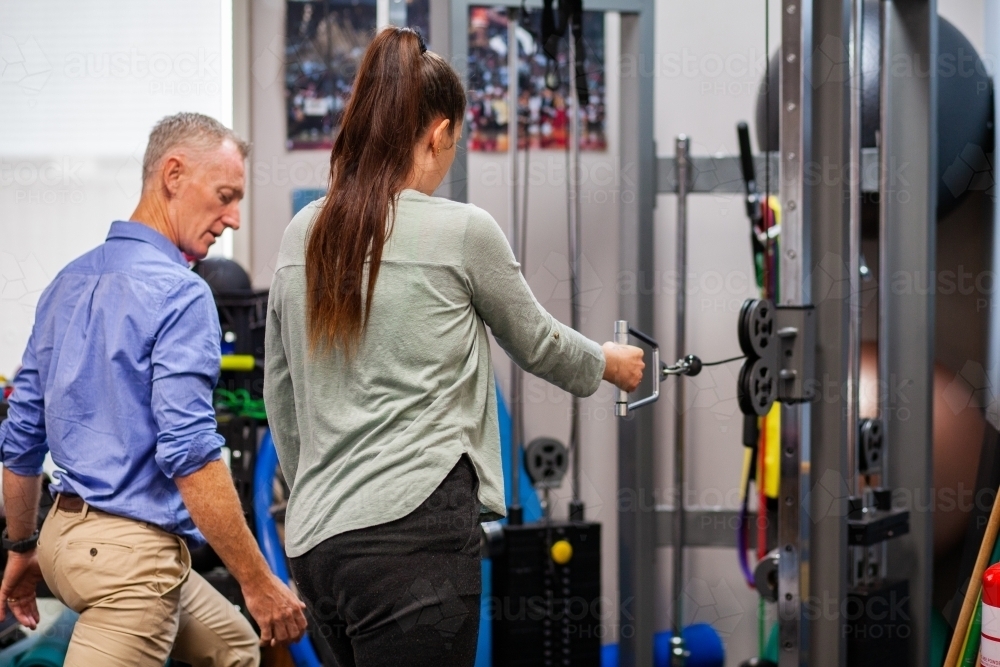 Image of Woman working with physio at physiotherapist clinic using ...
