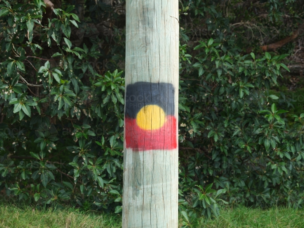 Image of Wooden pole painted with Aboriginal Australian flag ...