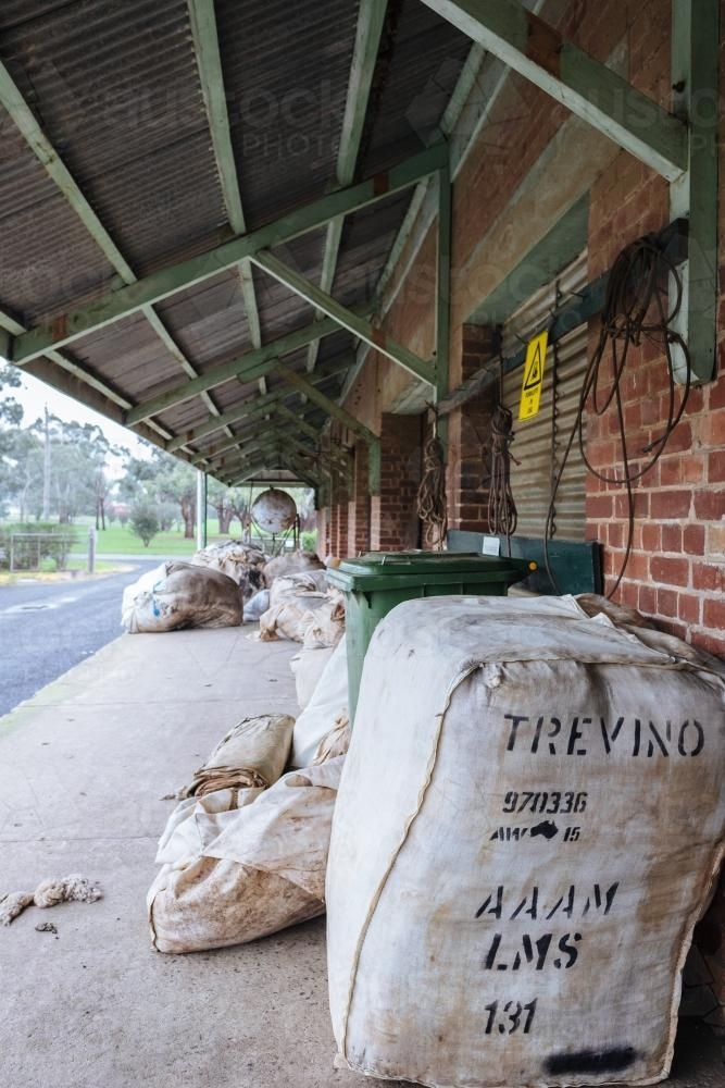 Image of Wool sacks outside wool grading warehouse - Austockphoto