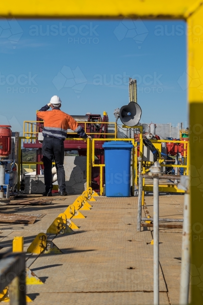 Image of Worker wearing full PPE on worksite - Austockphoto