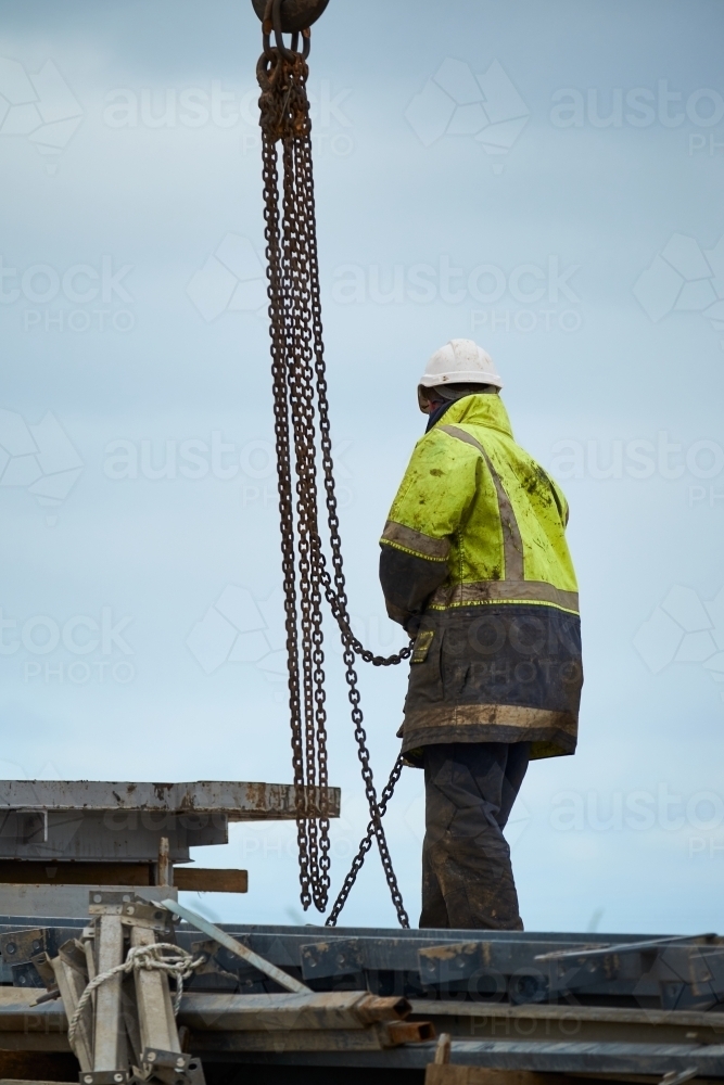 Image of Worker wearing full PPE on worksite - Austockphoto