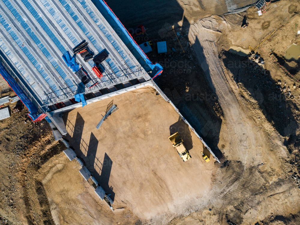 Image of Worksite with roller machine and bridge for road connection ...