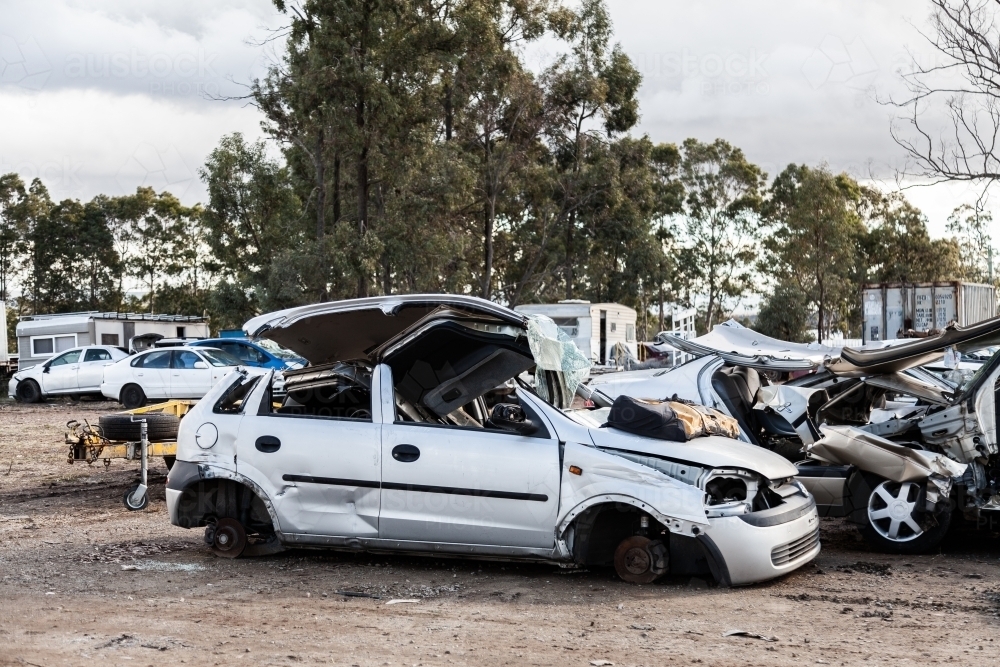 Image of Wrecked and smashed cars parked in car wreckers junkyard ...