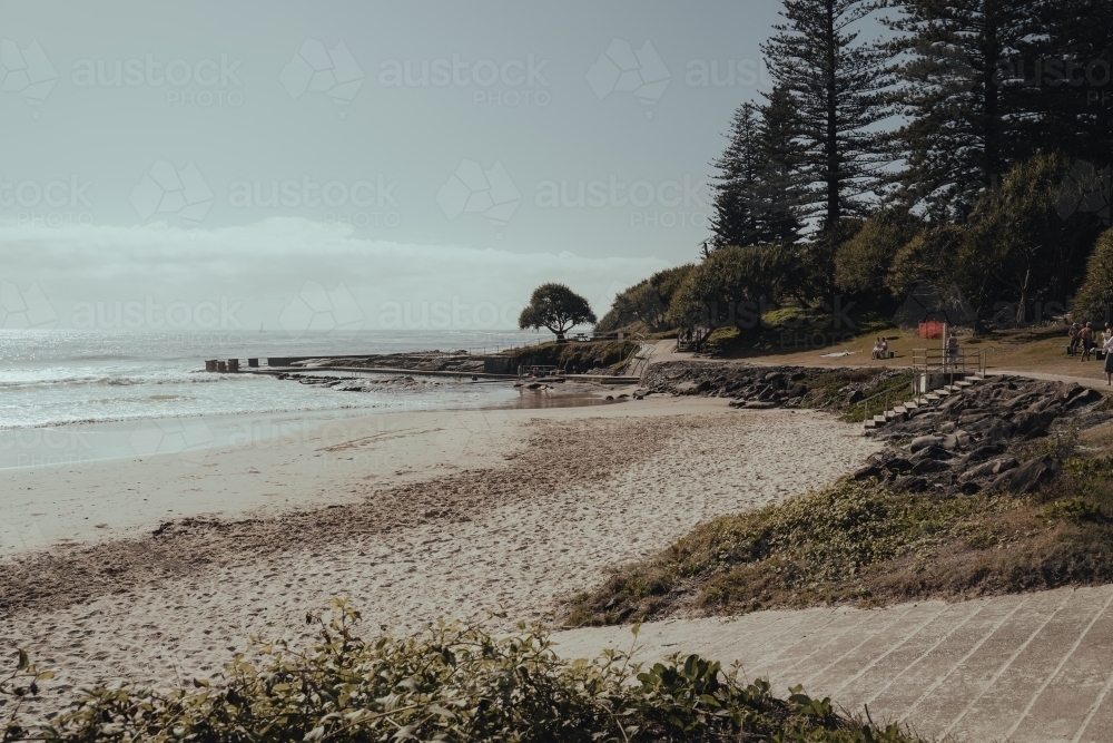 Image of Yamba Beach and ocean pool just after sunrise. - Austockphoto