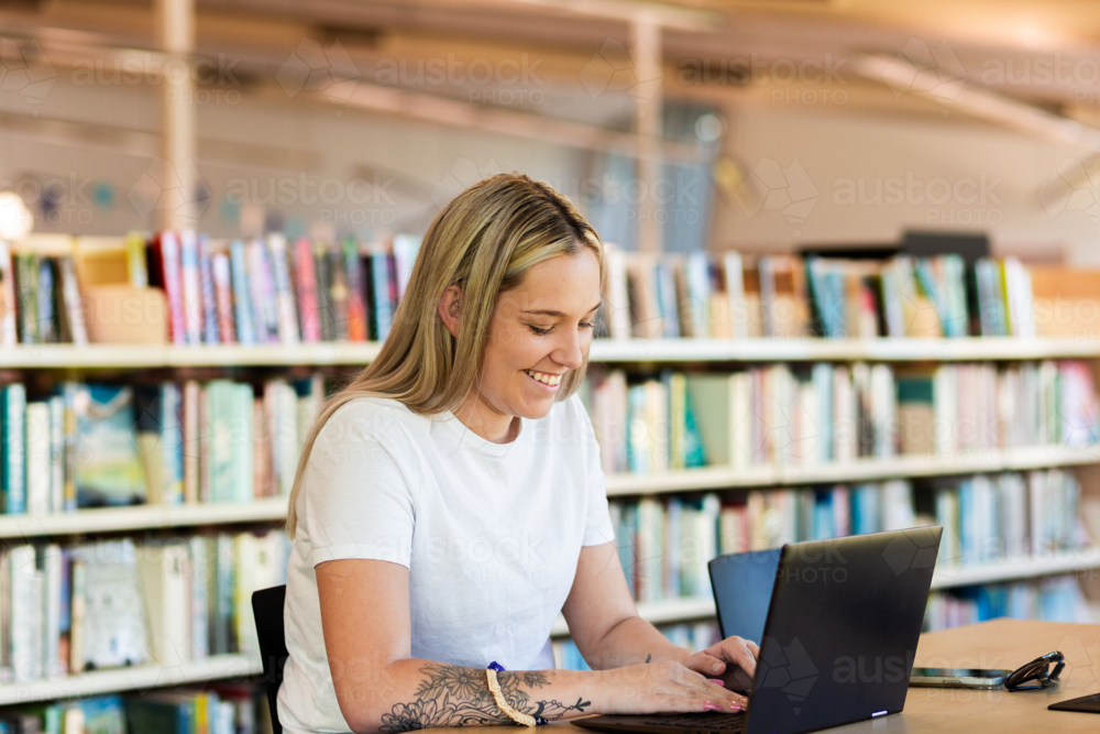 Image of Young Aboriginal Australian woman in her twenties at library ...