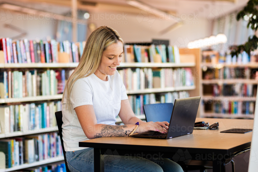 Image of Young Aboriginal Australian woman in her twenties at library ...