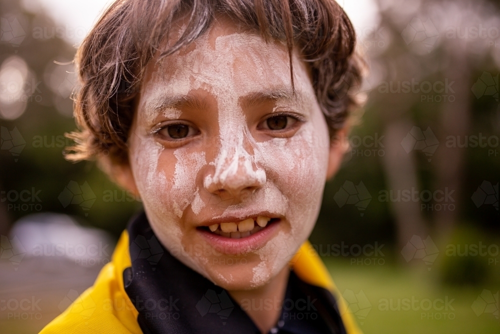 Image of Young Aboriginal boy smiling at the camera - Austockphoto