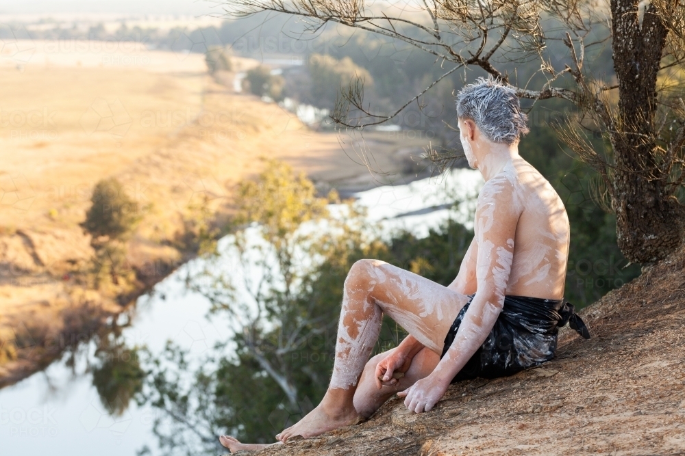Image of Young Aboriginal man looking out over Australian landscape ...