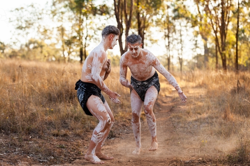 Image of Young Aboriginal men telling stories through paint and dance ...