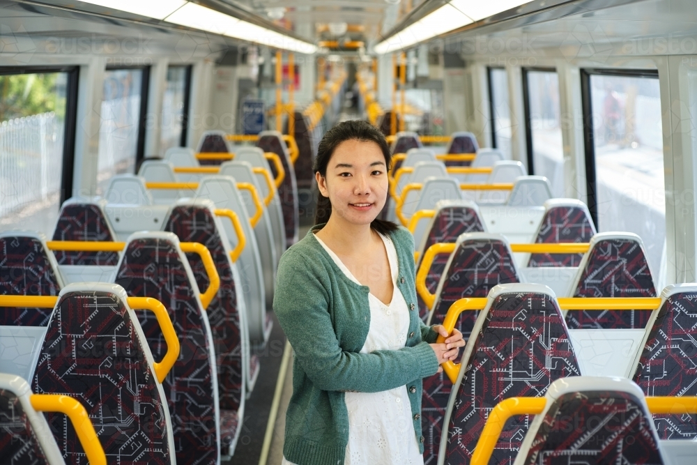 Image of Young Asian woman wearing cardigan sweater standing inside the ...