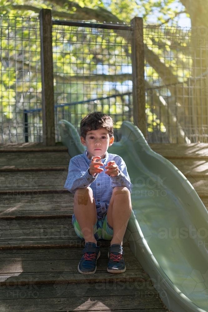 Image of Young boy at playground - Austockphoto
