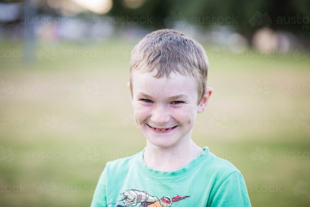 Image of Young caucasian boy with dimples smiling - Austockphoto