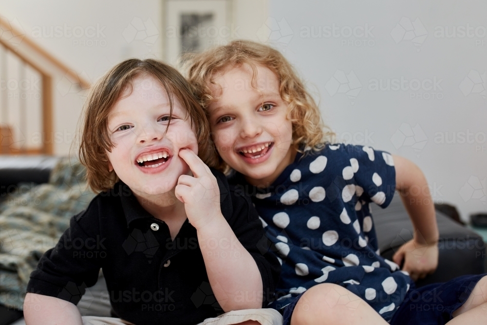 Image of Young children smiling for camera - Austockphoto