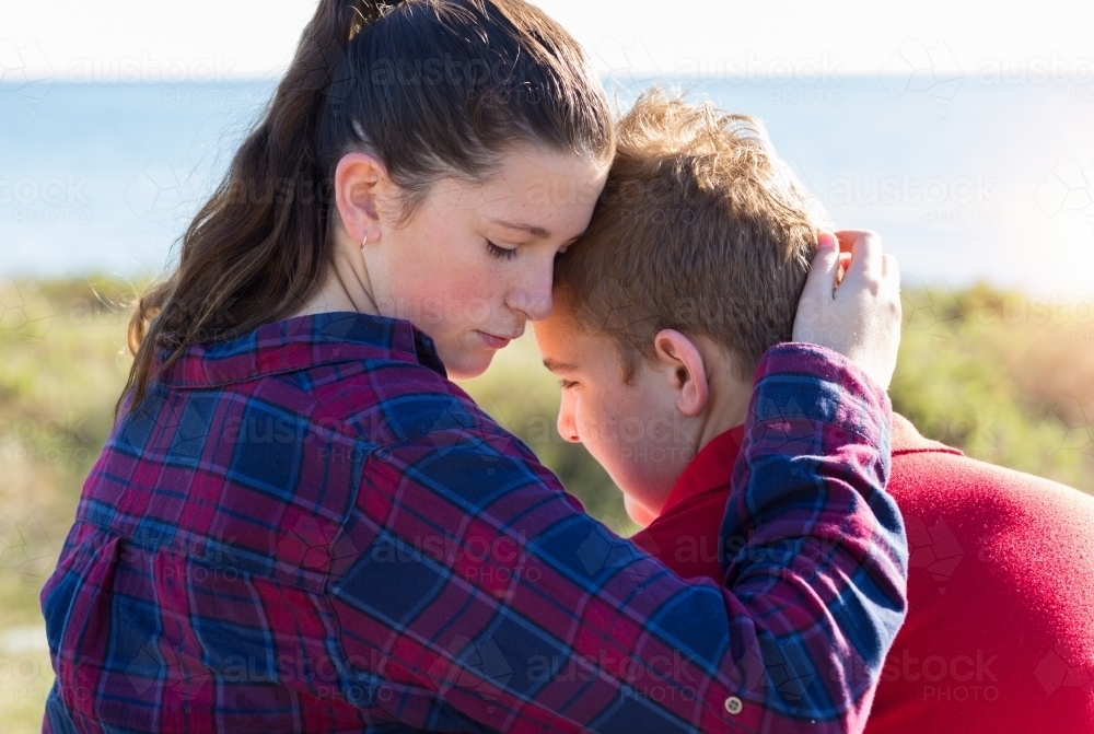 Image of Young couple close together - Austockphoto