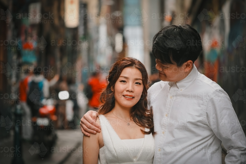 Image of Young engaged couple posing together in Hosier Lane, iconic ...