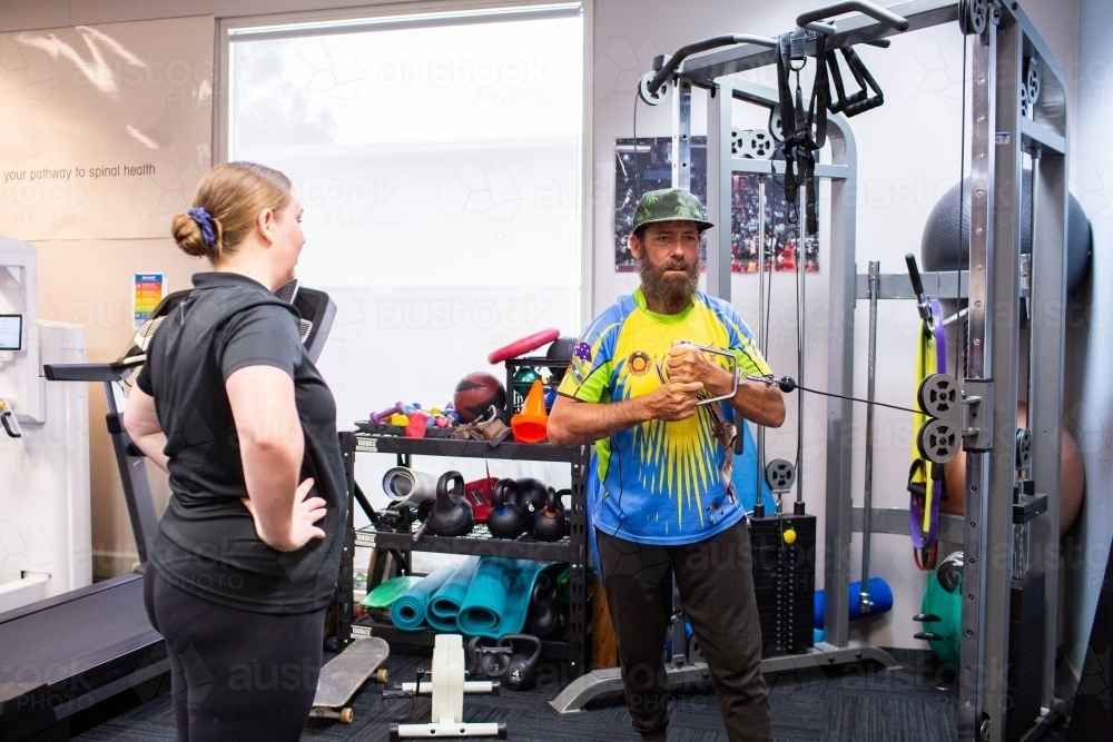 Image of Young female physio working with aboriginal australian client ...