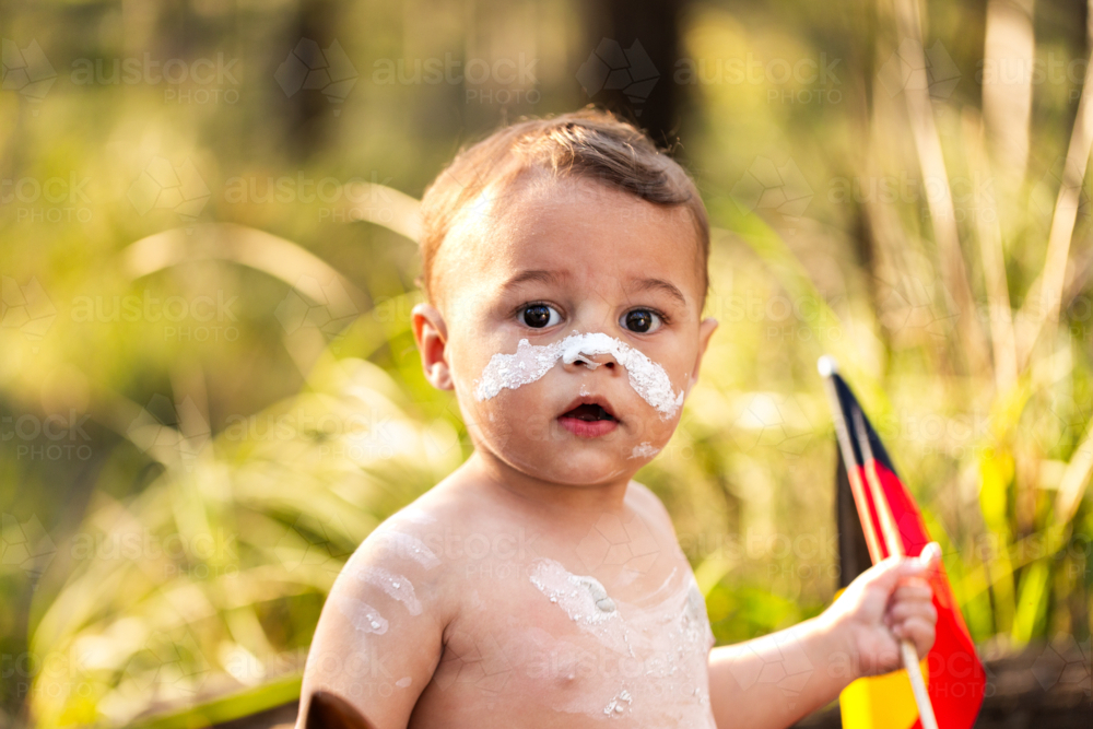 Image of Young First Nations Australian toddler boy painted in ochre in ...