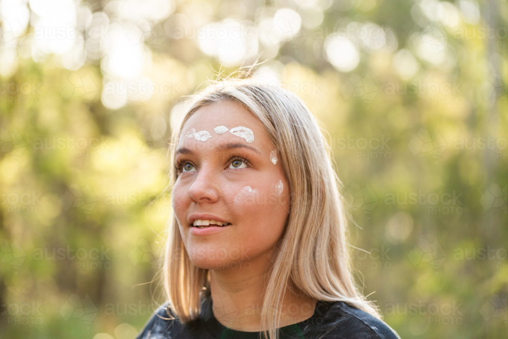 Image of Young First Nations Australian woman looking up with upwards ...
