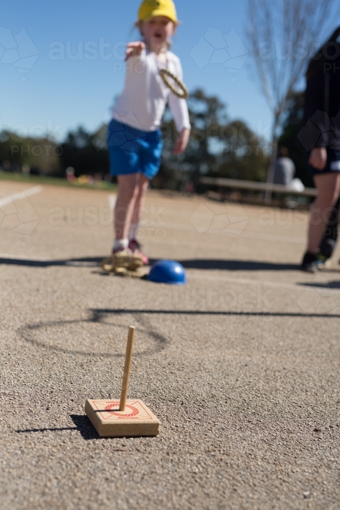 Image of Young girl playing quoits - Austockphoto