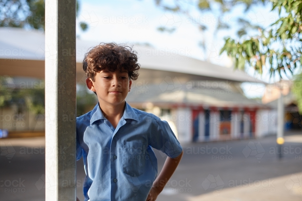 Image of Young school boy at school grounds - Austockphoto