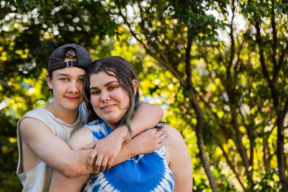 Image of Young teen aboriginal Australian kids hugging one another ...