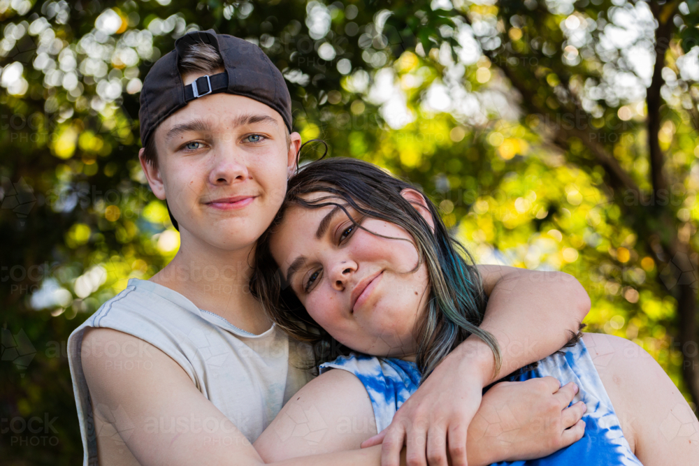 Image of Young teen aboriginal Australian kids hugging one another ...