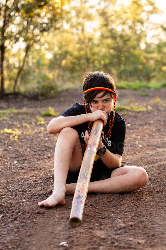 Image of Young tween Aboriginal kid outside in rural Australia playing ...