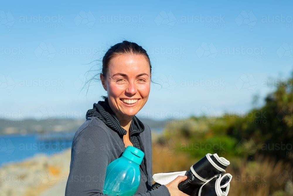 Image of Young woman after outdoors workout session - Austockphoto