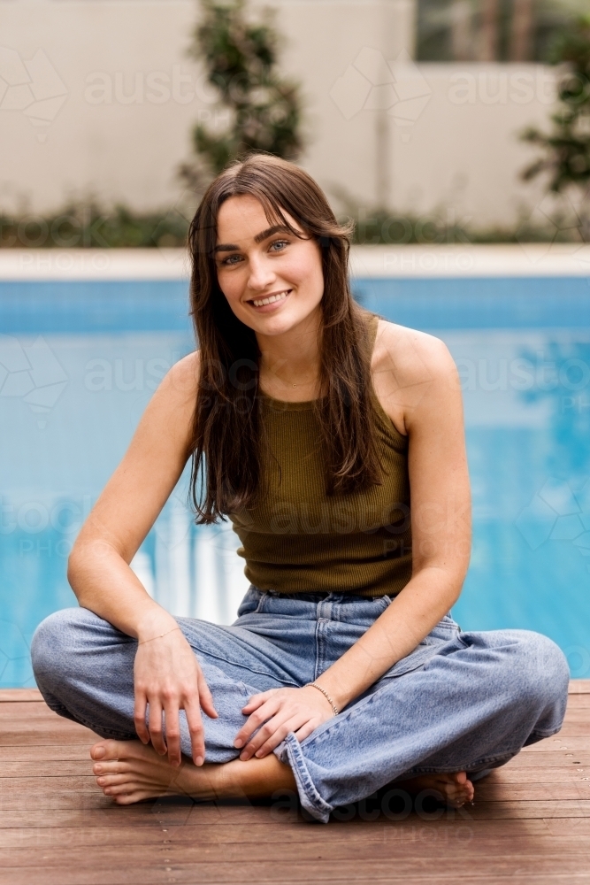 Image Of Young Woman Sitting Beside Swimming Pool Austockphoto